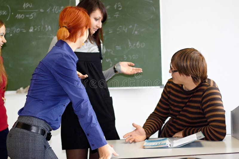 Teenage Boys Clustered Around a Girl at School Stock Photo - Image of ...