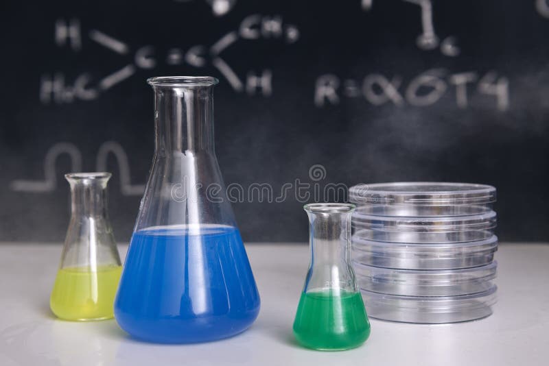 Classroom Desk with Flasks with Colored Chemicals Stock Photo - Image ...