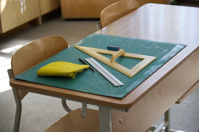 Classroom Desk with Math Tools, Ruler, and Eraser on a Cutting Mat ...
