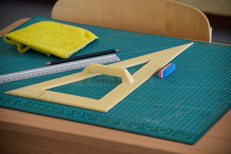 Classroom Desk with Math Tools, Ruler, and Eraser on a Cutting Mat ...