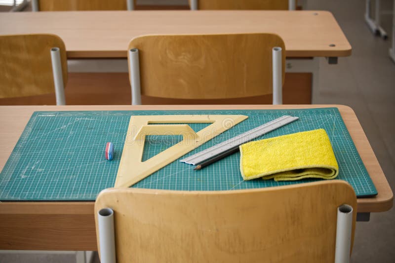 Classroom Desk with Math Tools, Ruler, and Eraser on a Cutting Mat ...
