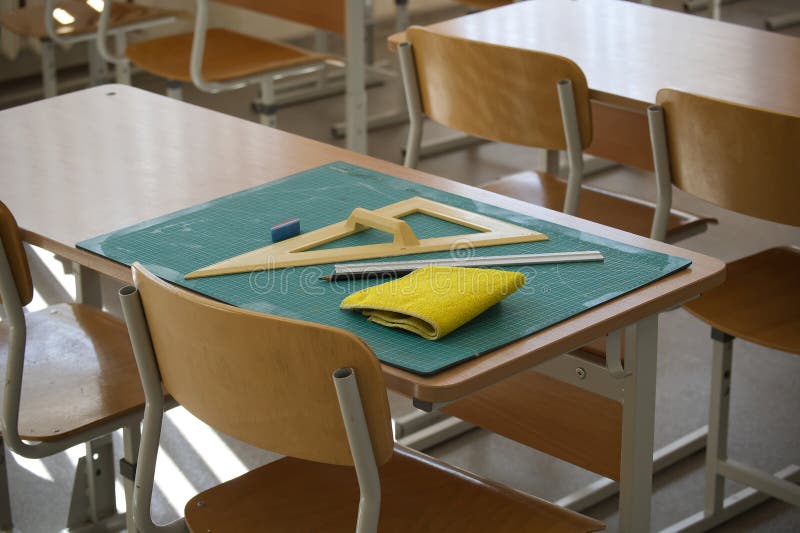 Classroom Desk with Math Tools, Ruler, and Eraser on a Cutting Mat ...