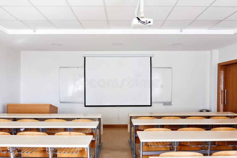 Classroom Interior with Projection Screen, White Board and Wooden Desks ...