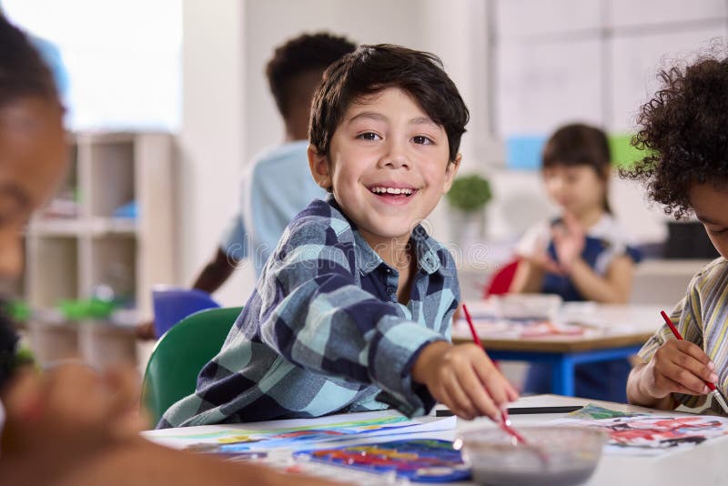Classroom Portrait of Smiling Male Elementary School Pupil in Art Class ...