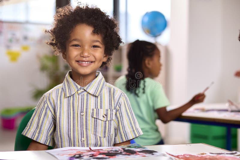 Classroom Portrait of Smiling Male Elementary School Pupil in Art Class ...