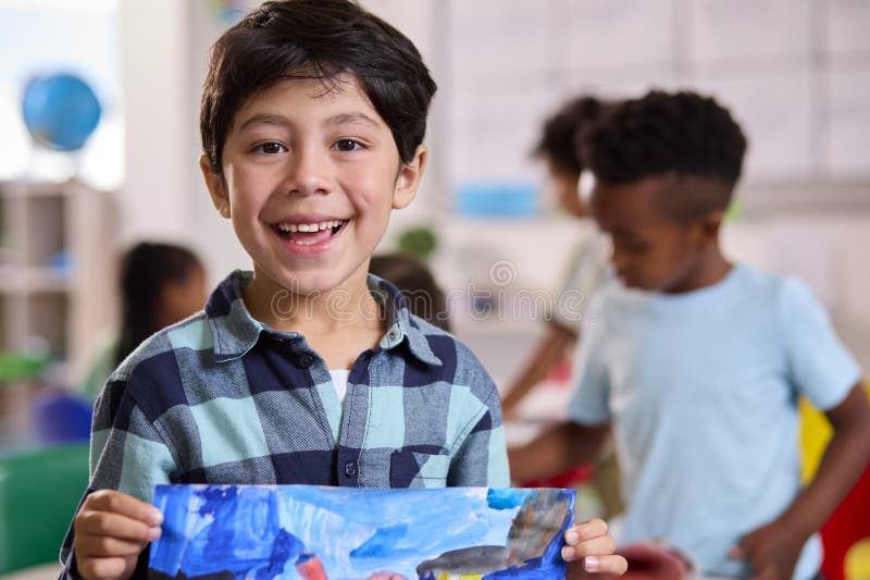 Classroom Portrait of Smiling Male Elementary School Pupil in Art Class ...