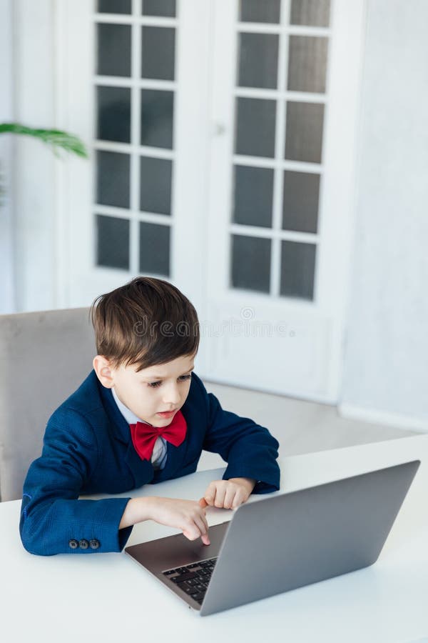 In the Classroom at School at the Laptop Programmer at the Computer ...