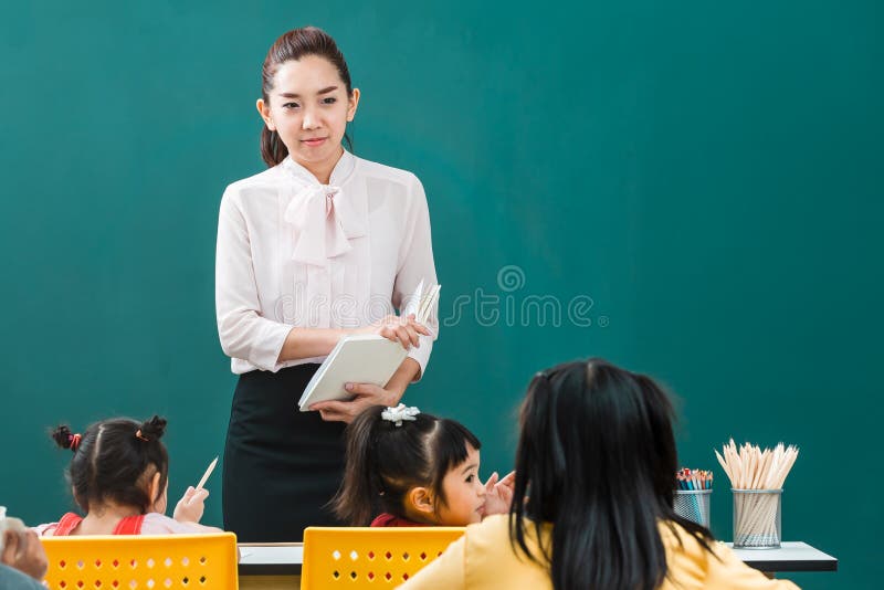In Classroom, Students Do Their Exercise Stock Image - Image of adult ...