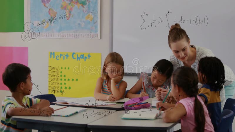 In Classroom, Teacher Helping Diverse Children with Math Problems Using ...