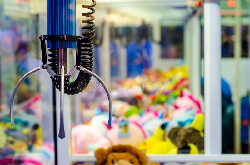 A Claw Crane Game Machine with Toys Stock Photo - Image of fair, doll ...