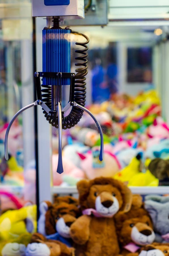 A Claw Crane Game Machine with Toys Stock Photo - Image of merchandiser ...