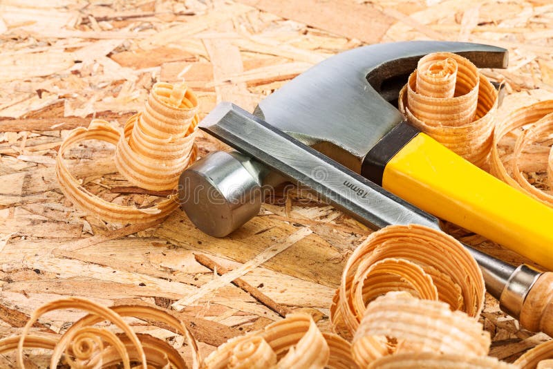 Claw Hammer and Carpenter Chisel with Wooden Chips Stock Image - Image ...