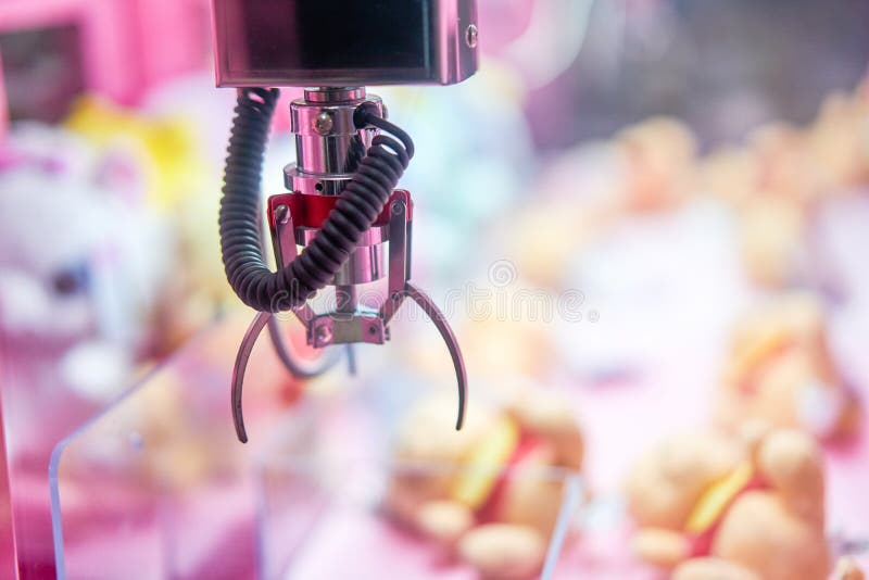 Claw Picker Doll Game Machine in Game Arcade Stock Image - Image of ...