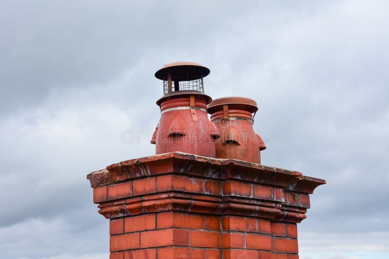 Clay Chimney Pots on Rooftops Stock Photo - Image of antennae, capped ...