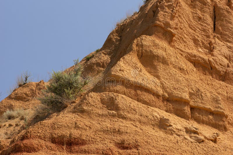 Clay cliff over blue sky stock photo. Image of rock - 354300750