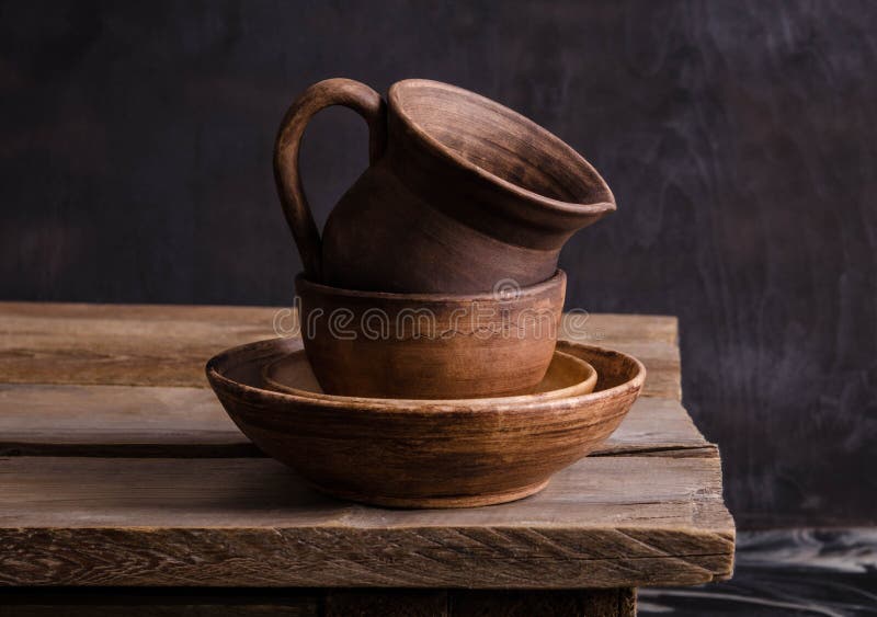 Clay Dishes on Wooden Table Stock Image - Image of rustic, decoration ...