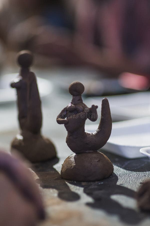 Clay Figures Being Molded To Create Mermaids Stock Photo - Image of ...