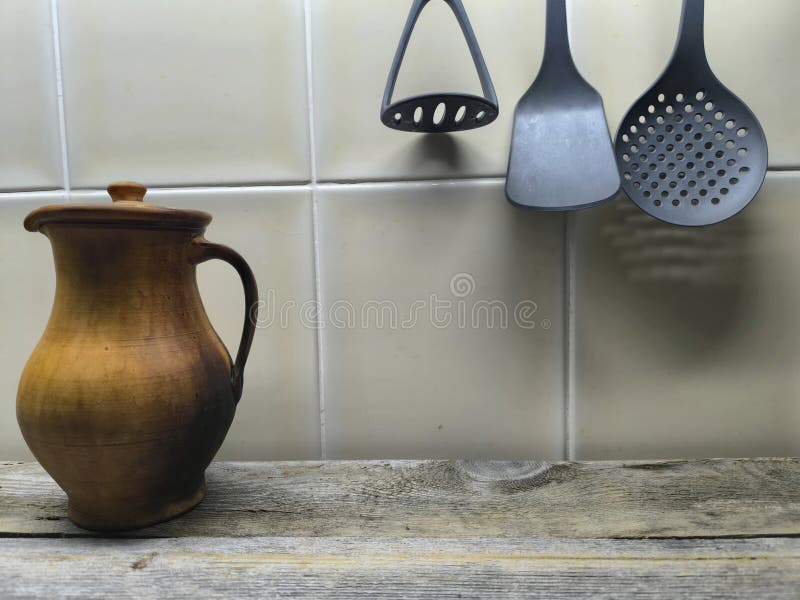 Clay jug and cutlery . stock image. Image of clay, utensil - 335494053