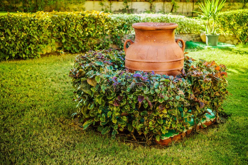 Clay old pitcher on lawn stock image. Image of handmade - 63341853