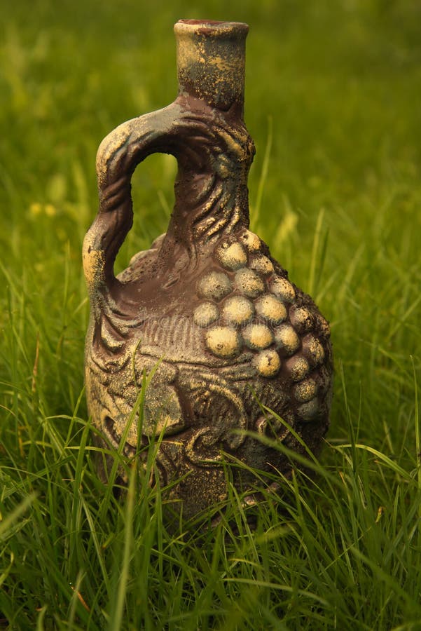 Clay pitcher on the lawn. stock image. Image of sunlight - 57777537