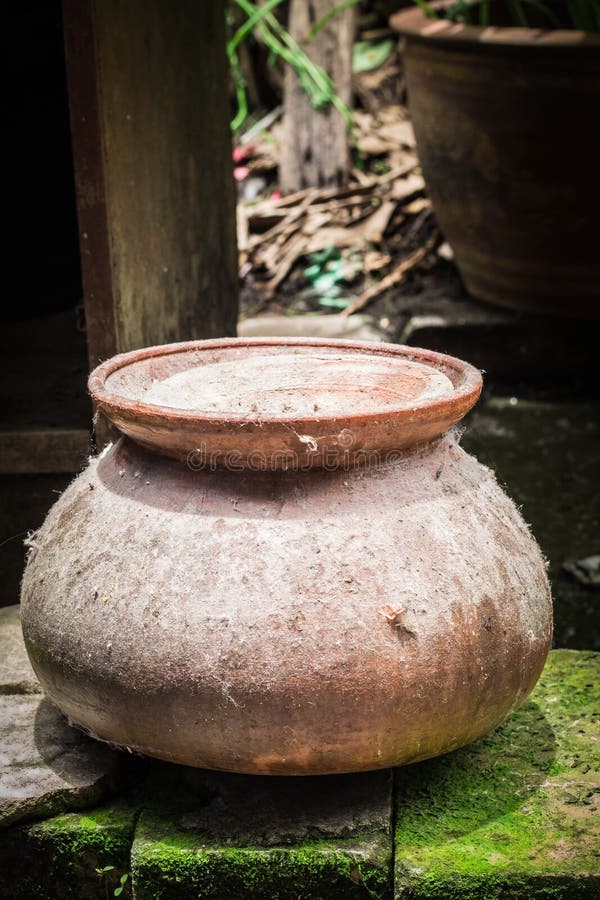 Clay pot on the brick stock photo. Image of earthenware - 59960374