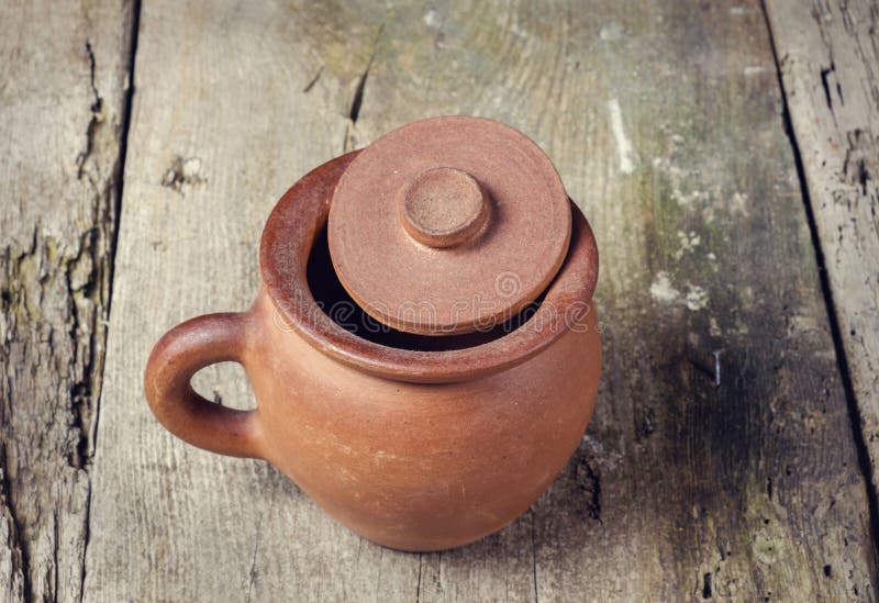 Clay Pot with Opened Cap on Old Grunge Table Stock Image - Image of ...