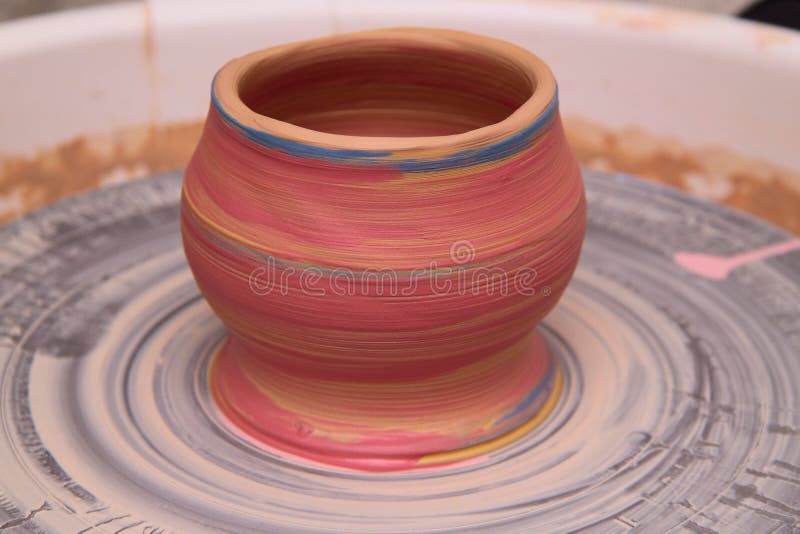 Clay pot on a potter wheel stock photo. Image of wheel - 70188256
