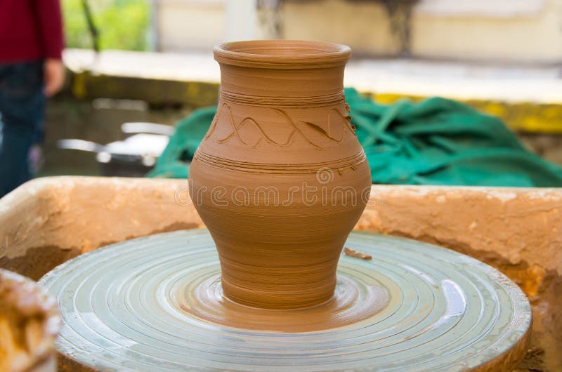 Clay Pot on a Pottery Wheel Stock Photo - Image of wheel, hand: 109645954
