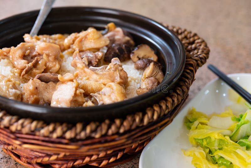 A Clay Pot Rice with Chicken and Mushrooms and Cabbage Stock Photo ...
