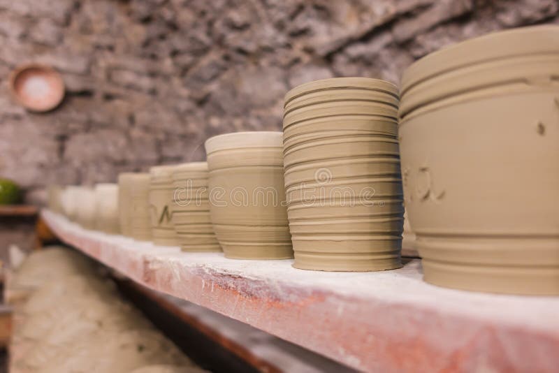 Clay Pots Stand on a Shelf in a Row Stock Image - Image of decorative ...