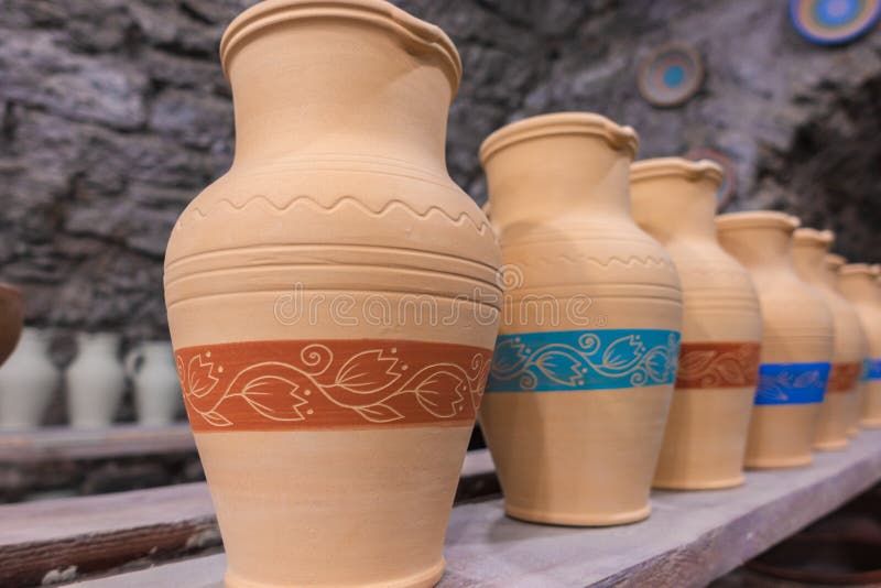 Clay Pots Stand on a Shelf in a Row Stock Photo - Image of container ...