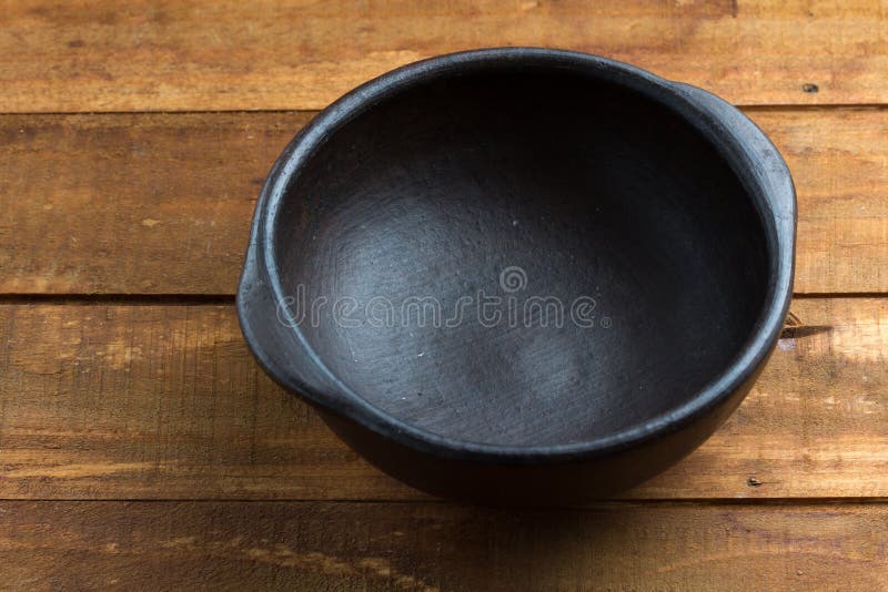 Clay Pottery Plate on the Wooden Table. Toning Stock Photo - Image of ...
