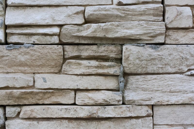 Clay Sandstone Gray Bricks. Wall With Protruding Layered Stone Blocks ...