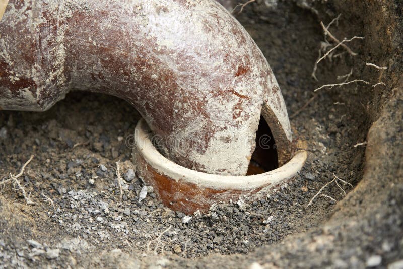 Clay Sewer Pipe with Hole, Broken, Exposed in the Ground Stock Photo ...