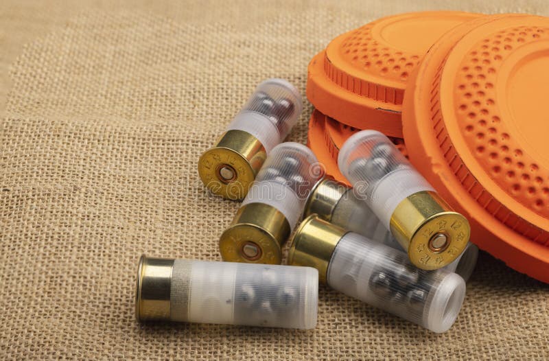Clay Shooting Target with Shotgun Shell on Sackcloth Background , Clay ...