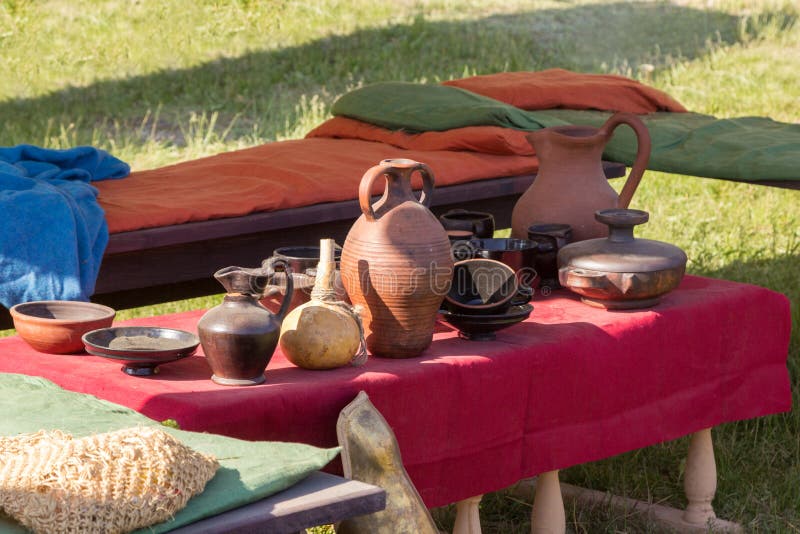 Clay Utensils on Table with a Red Cloth Coverings Stock Photo - Image ...