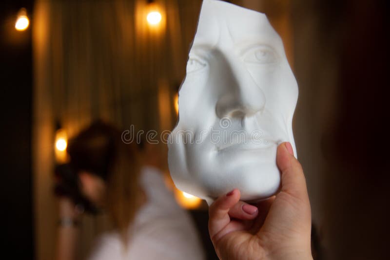 Clay White Mask in the Hands of a Girl. White Mask in the Form of a ...