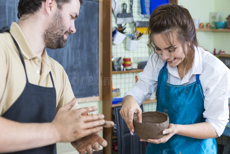 Claymaking Process Concept. Two Cheerful Professional Ceramists during ...