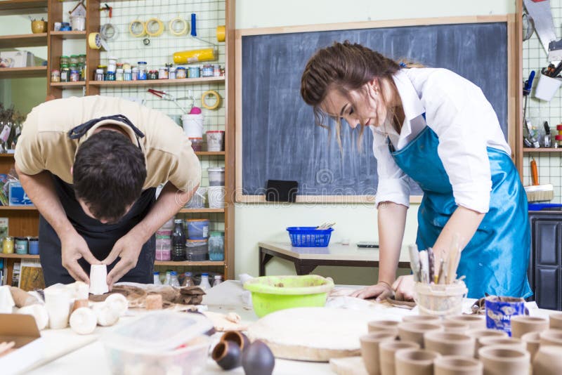 Claymaking Process Concept. Two Cheerful Professional Ceramists during ...