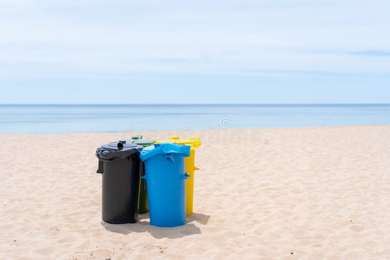 Clean beach garbage bins stock photo. Image of environment - 249882490