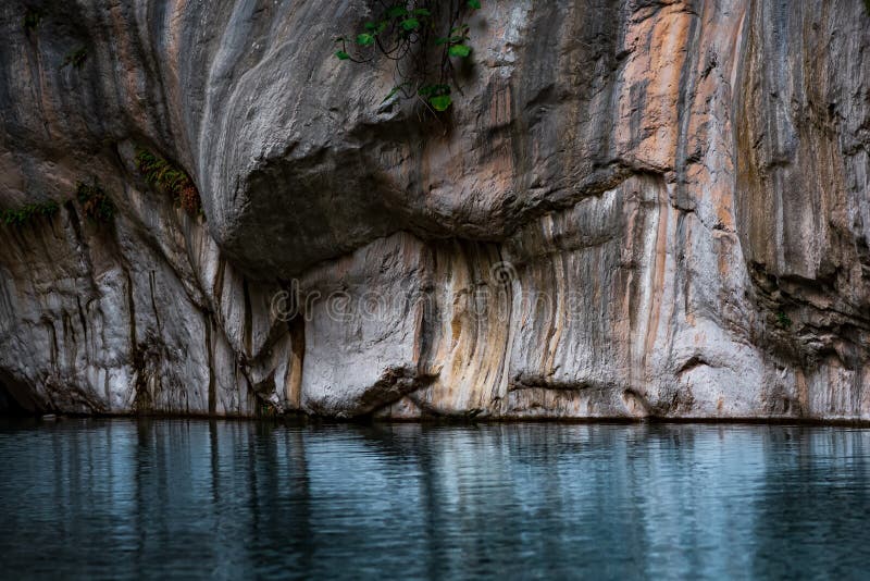 Clean Blue River with Rocky Banks at the Bottom of a Deep Canyon Stock ...