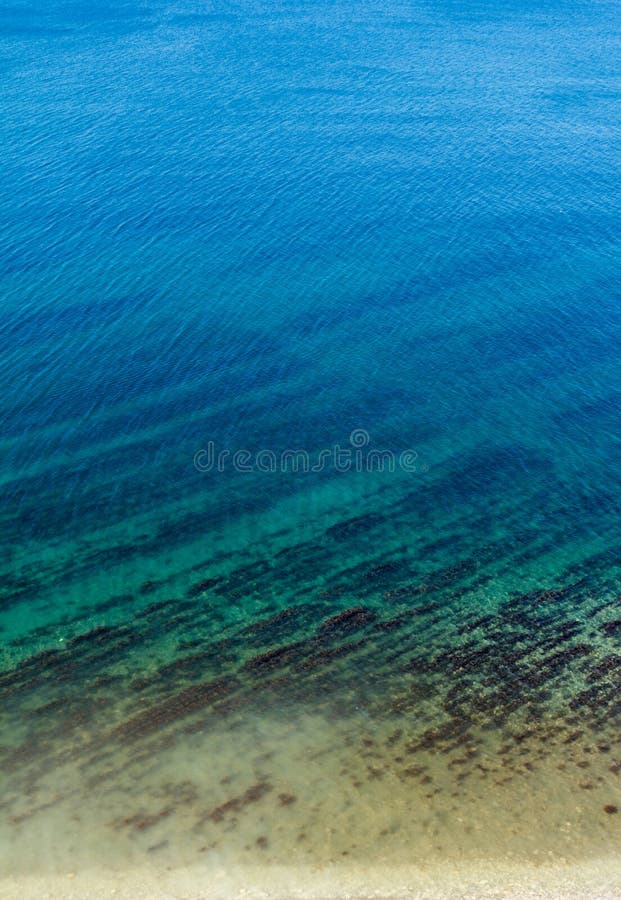 Clean Blue Sea, with a Pebbly-rocky Beach Stock Photo - Image of ...
