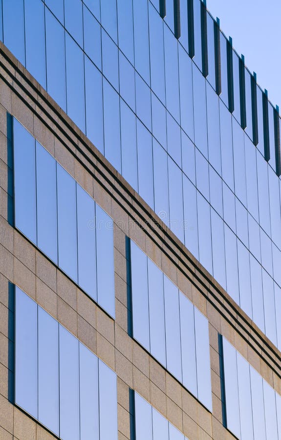 Clean Blue Sky Reflection in the Windows of an Office Building. Stock ...
