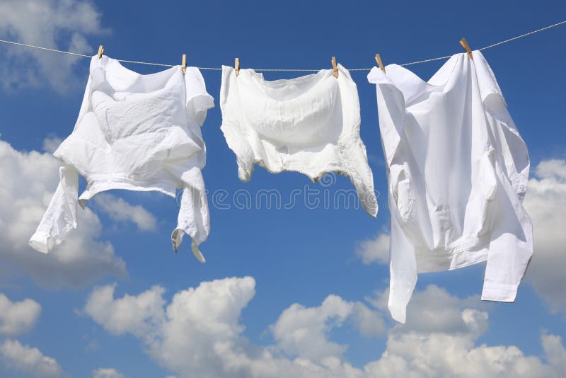 Clean Clothes Hanging on Washing Line Against Sky. Drying Laundry Stock ...