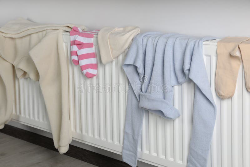 Clean Clothes on White Heating Radiator Indoors Stock Image - Image of ...