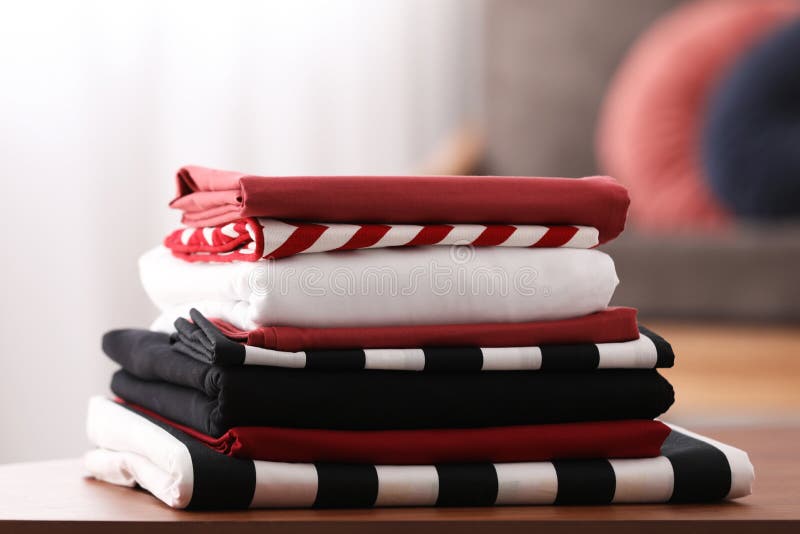 Clean Color Folded Bed Linens on Table Indoors Stock Image - Image of ...