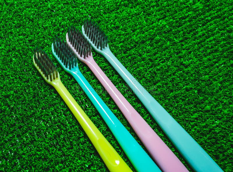 Clean Colorful Toothbrushes on Green Grass Stock Photo - Image of ...