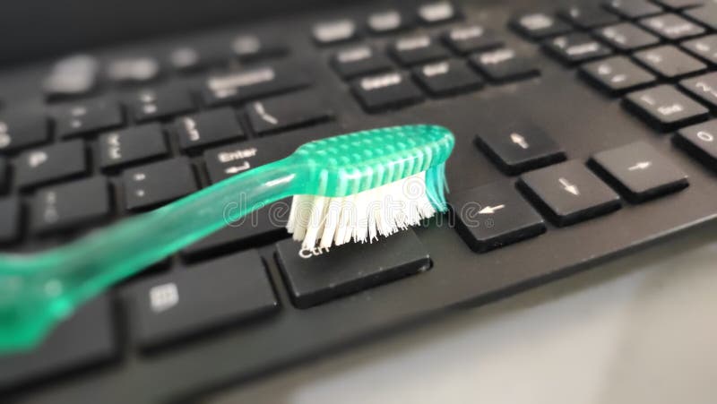 Clean Computer Keyboard Using Toothbrush Stock Image - Image of green ...