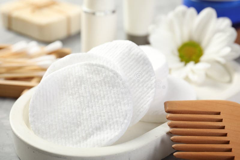 Clean Cotton Pads and Comb on Grey Table, Closeup Stock Image - Image ...