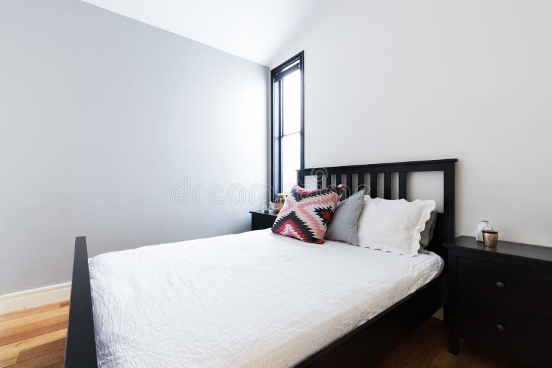 Clean Crisp Modern Bedroom with Light Grey Feature Wall Stock Image ...